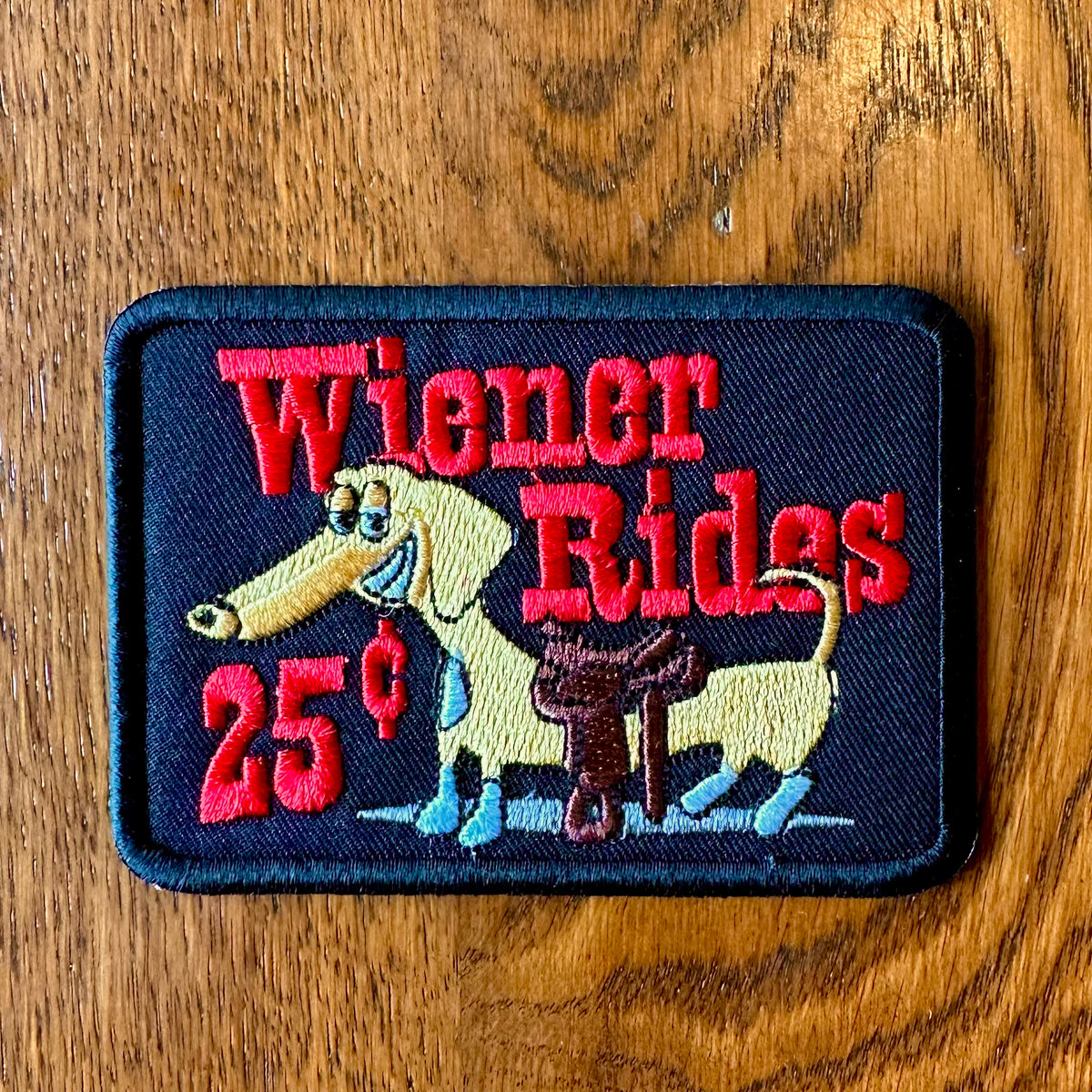 Wiener Rides 25¢ Patch - Black – Rusty Lids